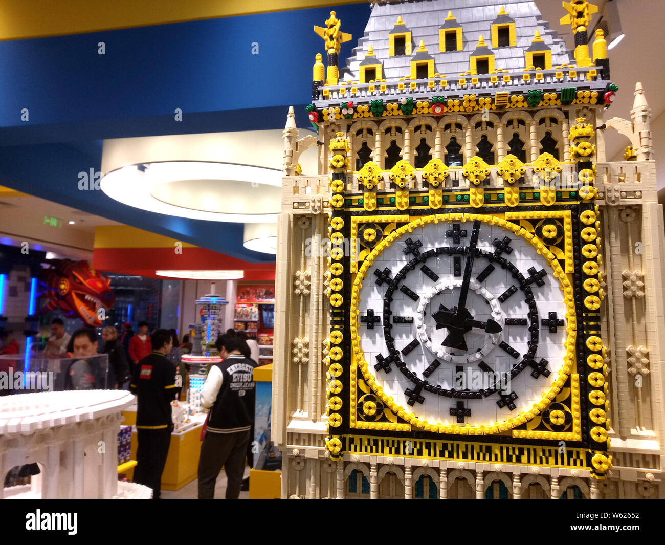People visit the Lego Flagship store at Shanghai ShiMao Festival City ...