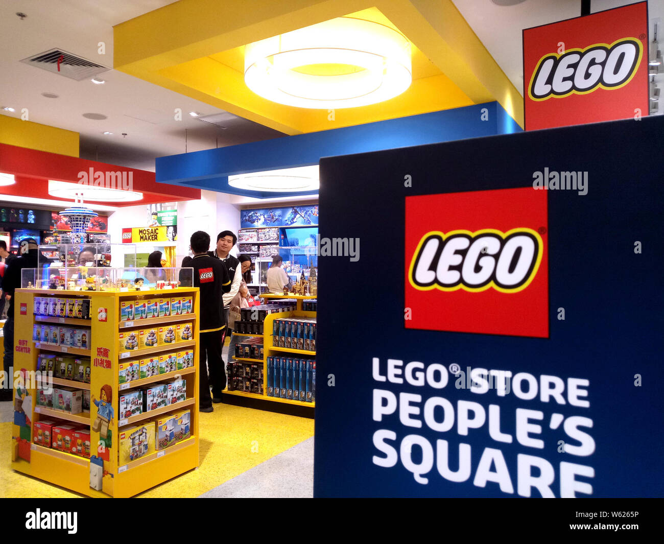 People visit the Lego Flagship store at Shanghai ShiMao Festival City ...