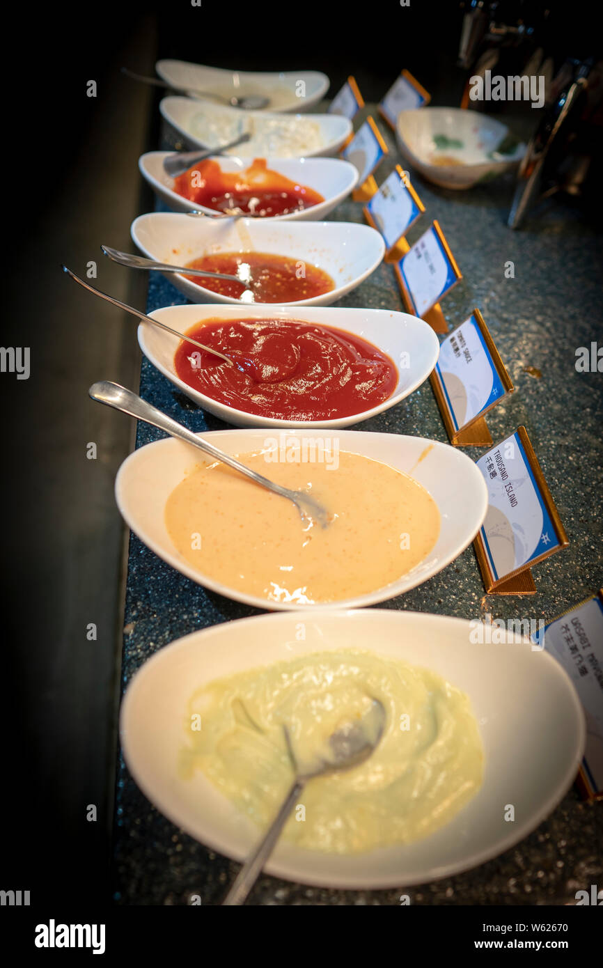 Variety sauces & dips selection on asian japanese buffet table ...