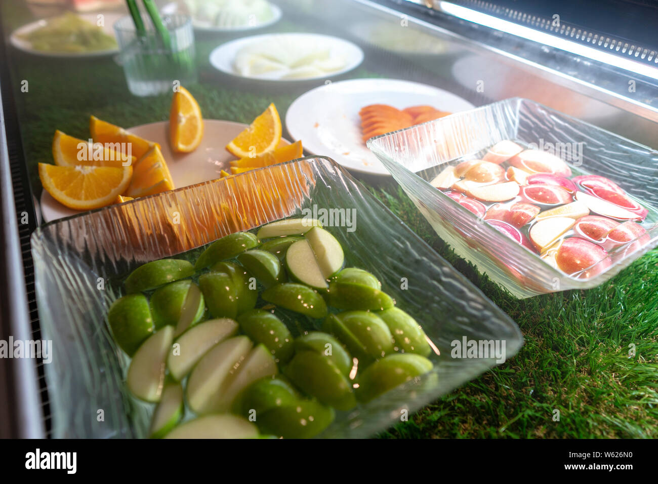 Fresh sliced fruit on a buffet table. Asian buffet restaurant Stock ...