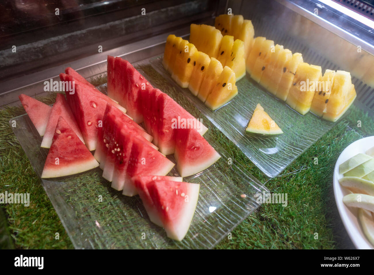 Fresh sliced fruit on a buffet table. Asian buffet restaurant Stock ...
