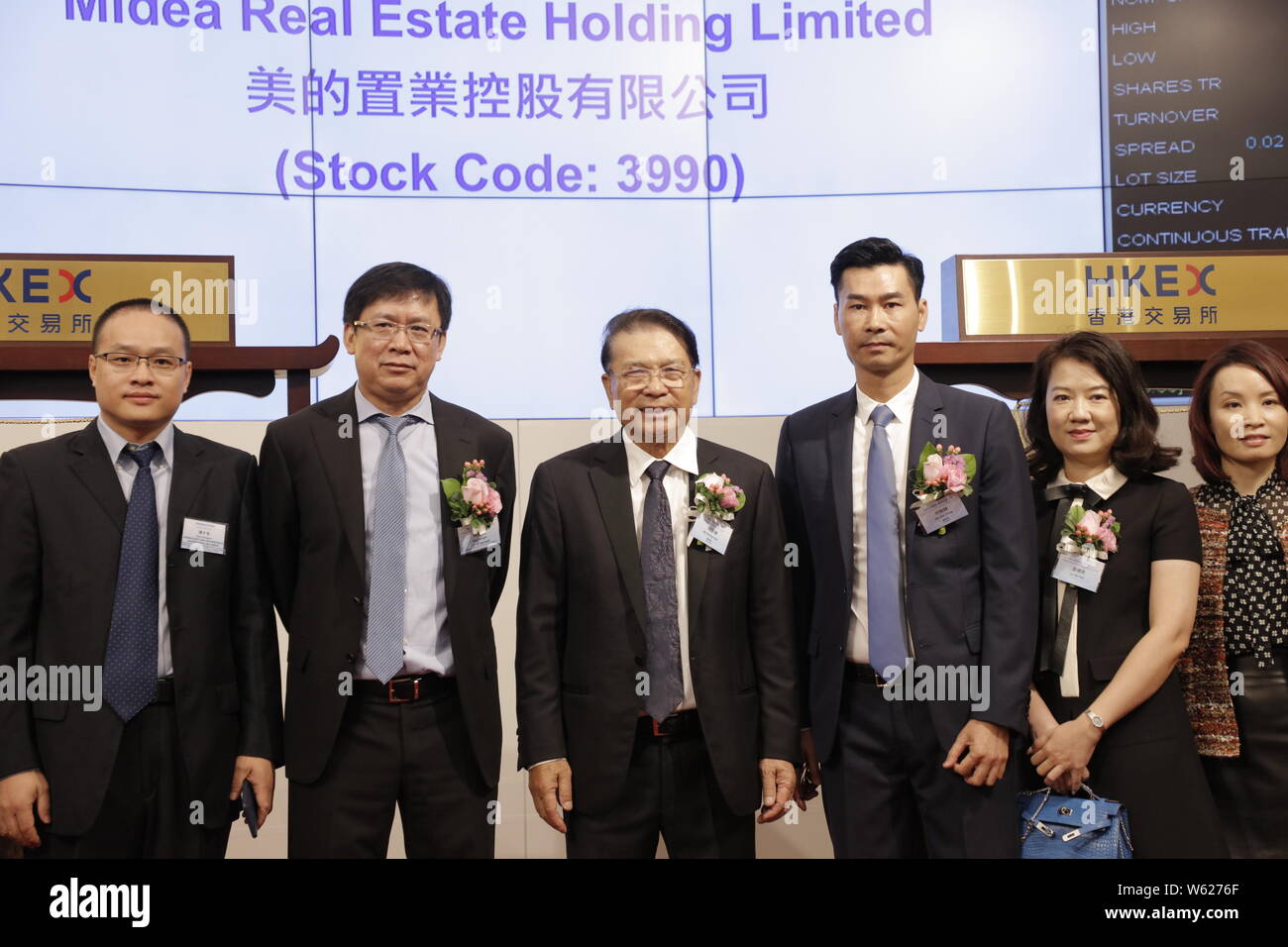 Hao Hengle, second left, chairman of Midea Group's Midea Real Estate ...