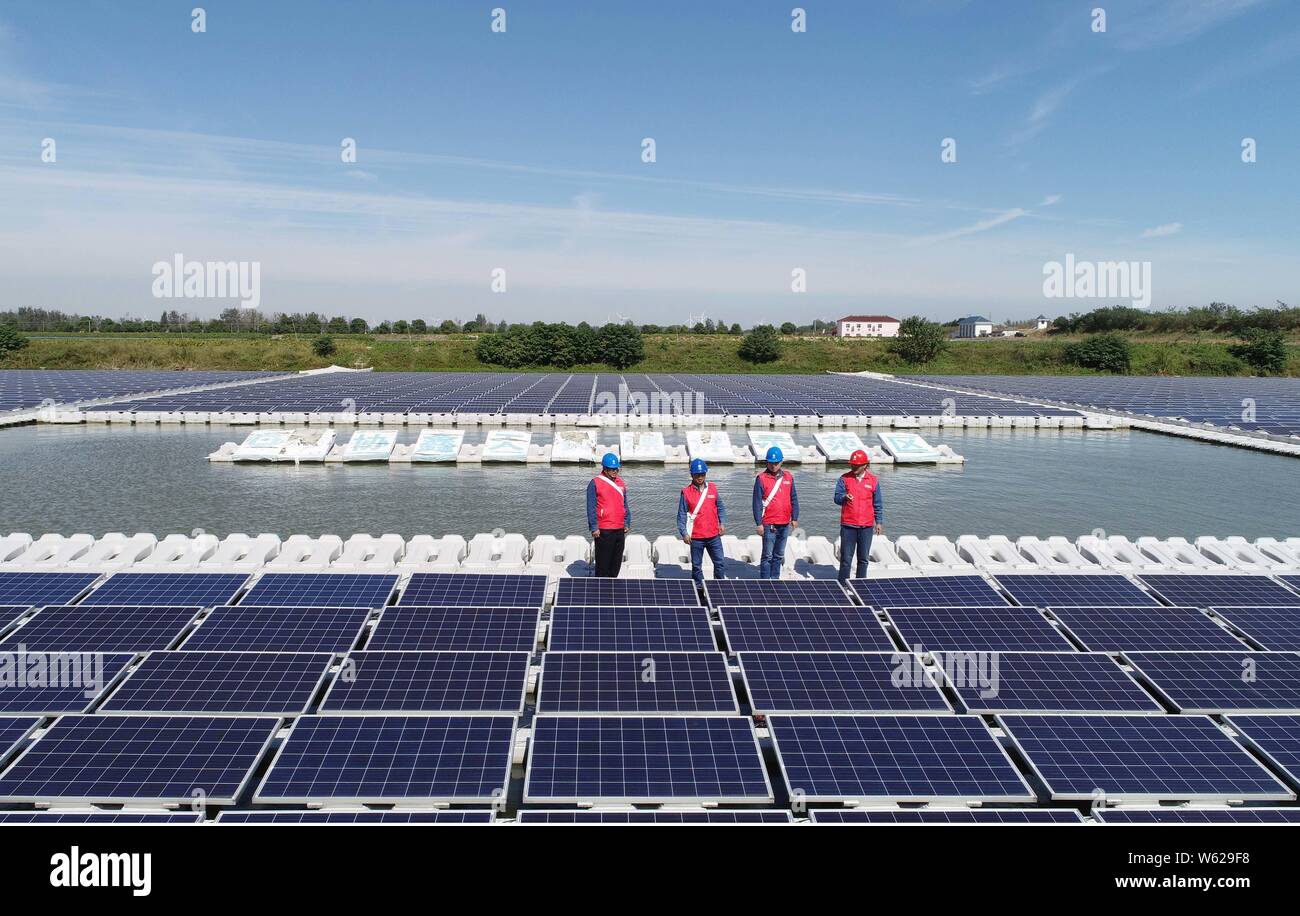 Aerial view of a floating solar energy farm at a photovoltaic power ...