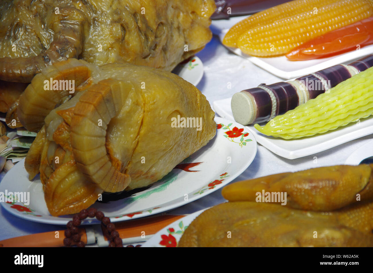 Various rare stones in the shape of Chinese dishes are on display at ...