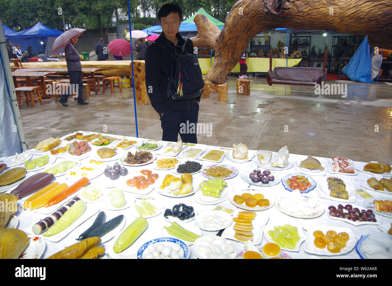 Various rare stones in the shape of Chinese dishes are on display at ...