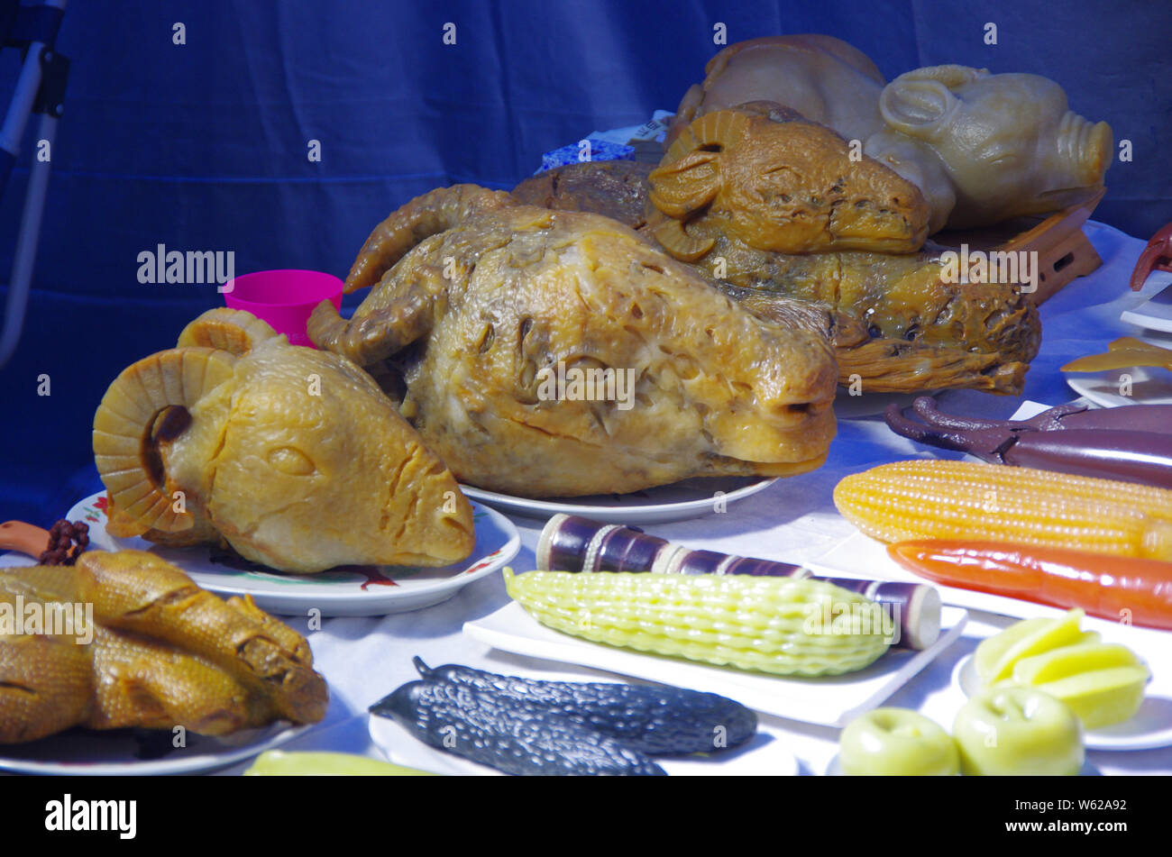 Various rare stones in the shape of Chinese dishes are on display at ...