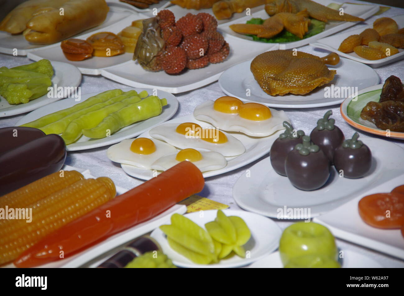 Various rare stones in the shape of Chinese dishes are on display at ...