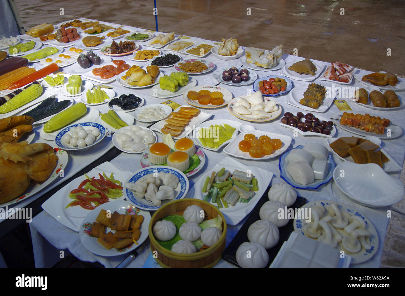Various rare stones in the shape of Chinese dishes are on display at ...