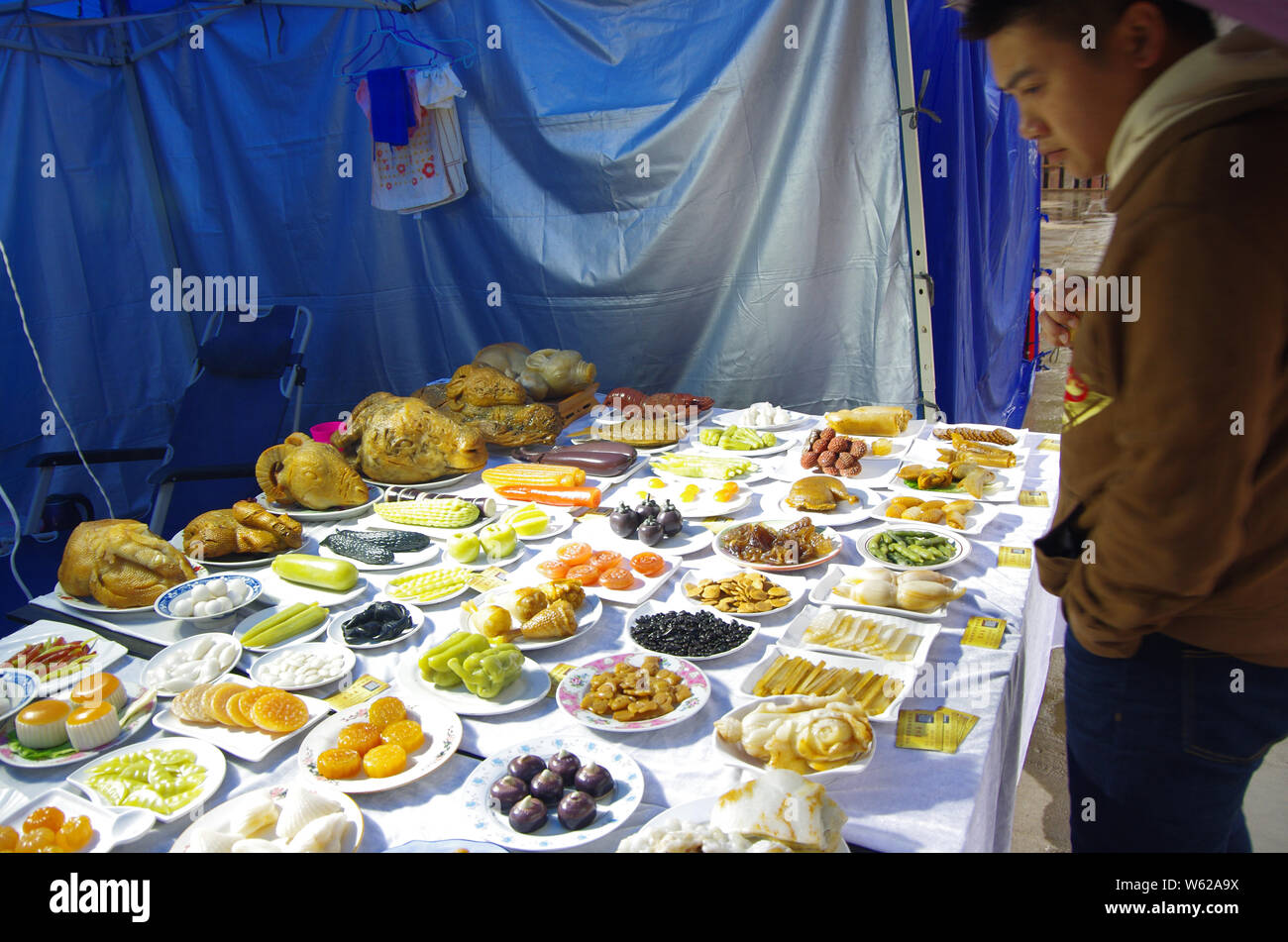 Various rare stones in the shape of Chinese dishes are on display at ...