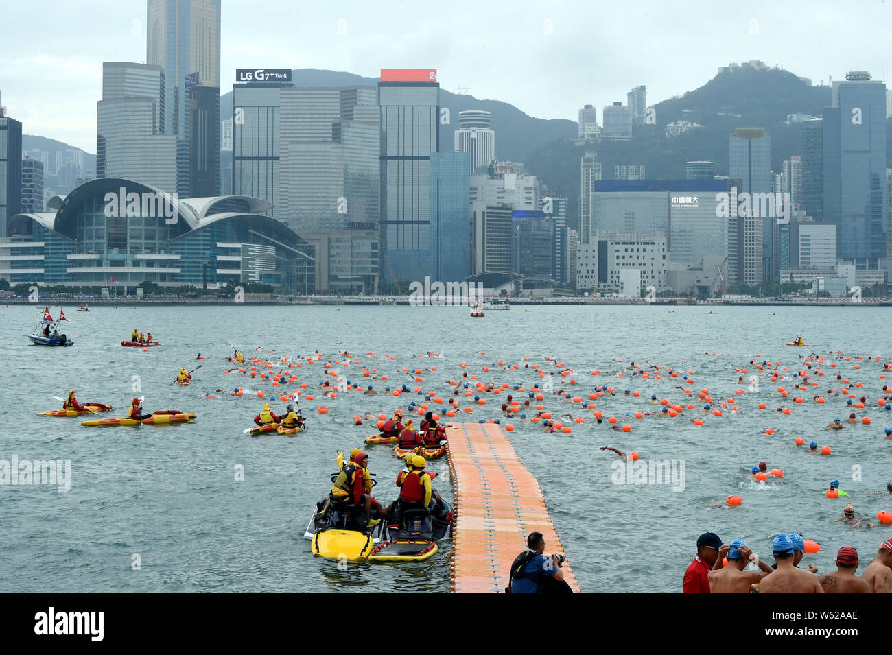 Thousands of swimmers take part in the annual Cross-Harbour swim in ...