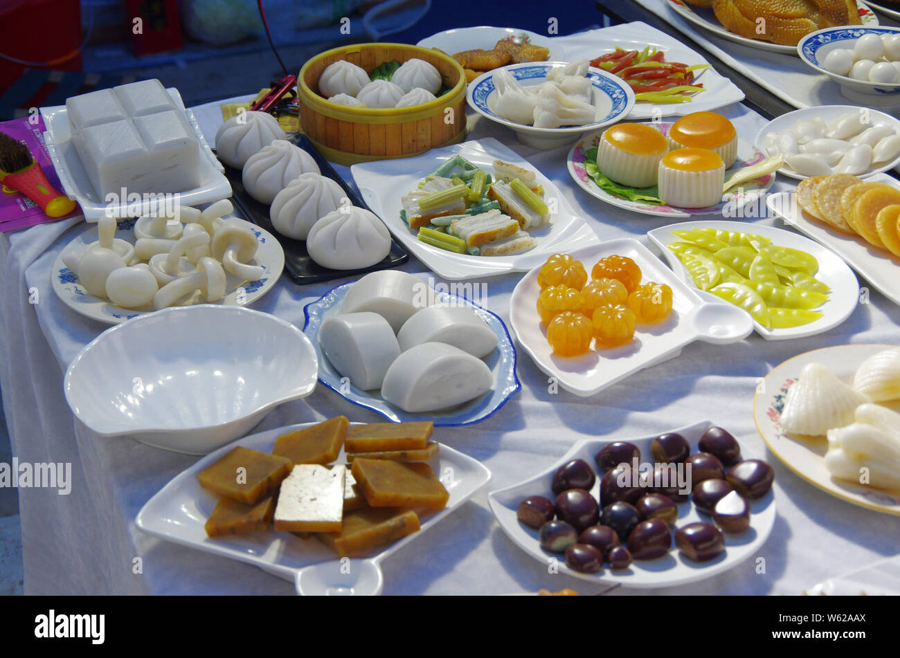 Various rare stones in the shape of Chinese dishes are on display at ...