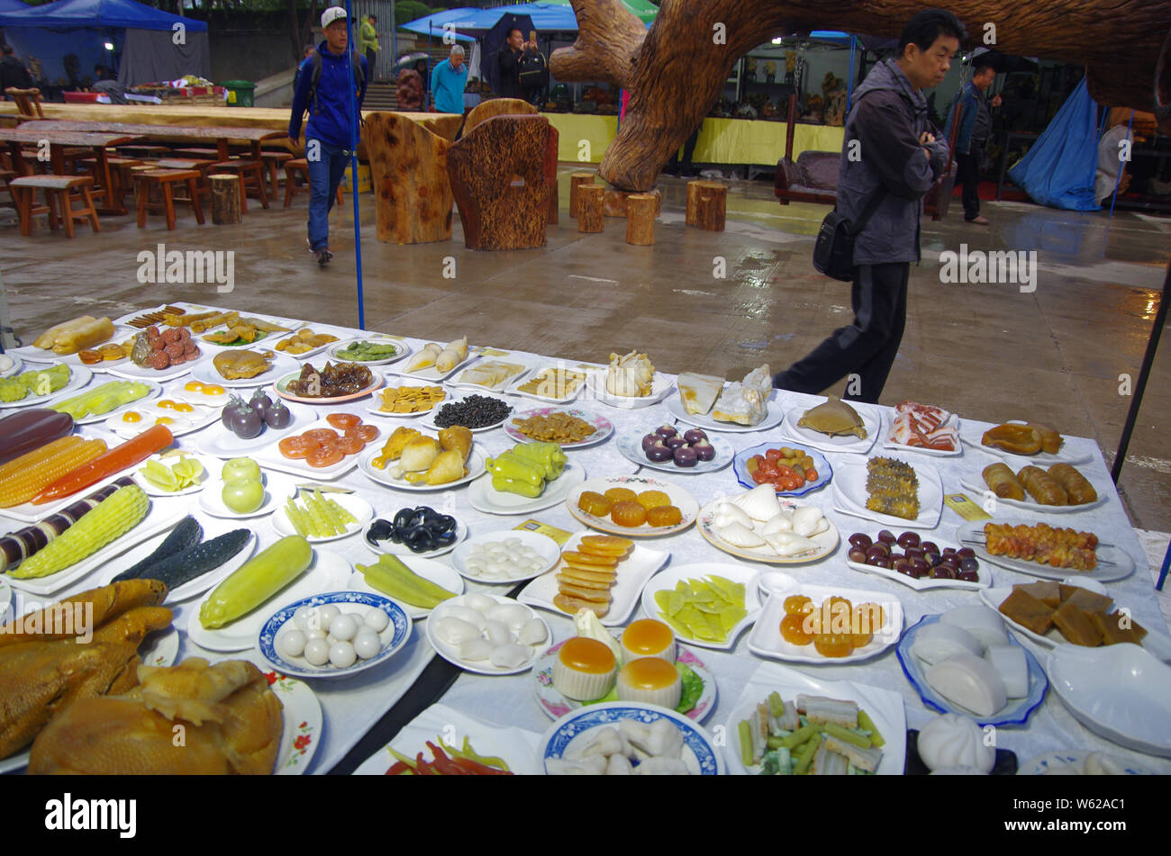 Various rare stones in the shape of Chinese dishes are on display at ...