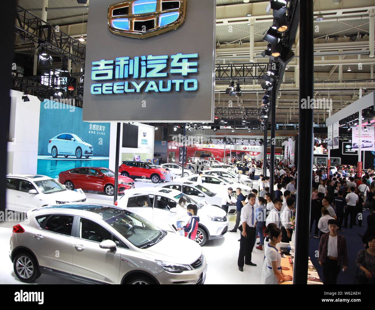 --FILE--People visit the stand of Geely Auto during an exhibition in ...