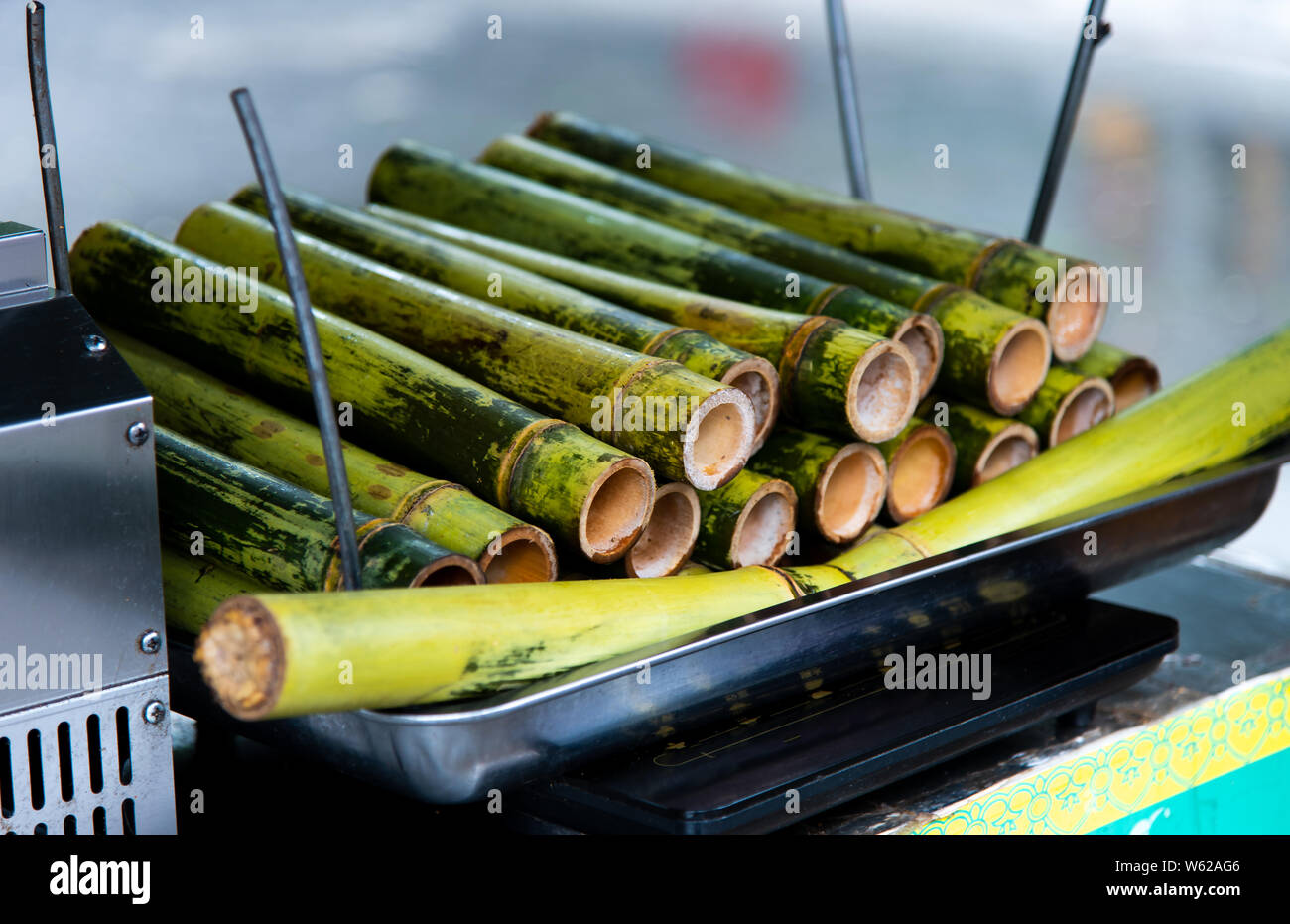 Sticky rice cooked in bamboo on the food street in China Stock Photo ...