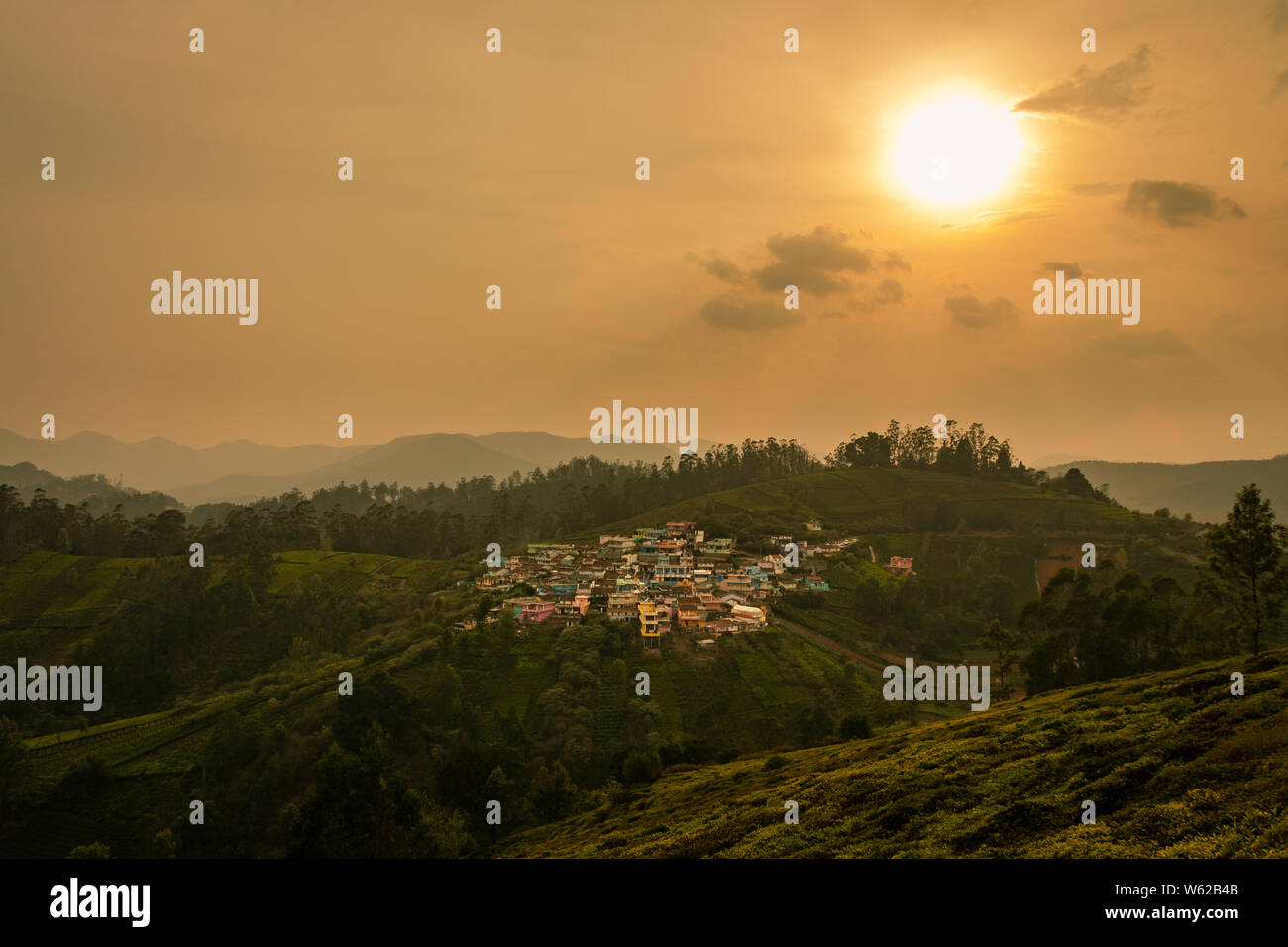 small village on hill top with green forest of western ghat image is ...