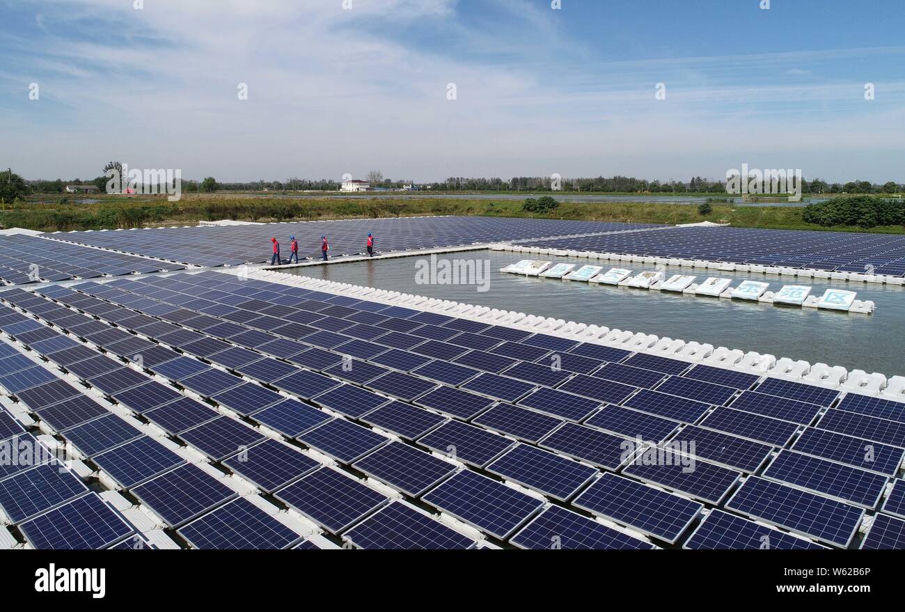 Aerial view of a floating solar energy farm at a photovoltaic power ...