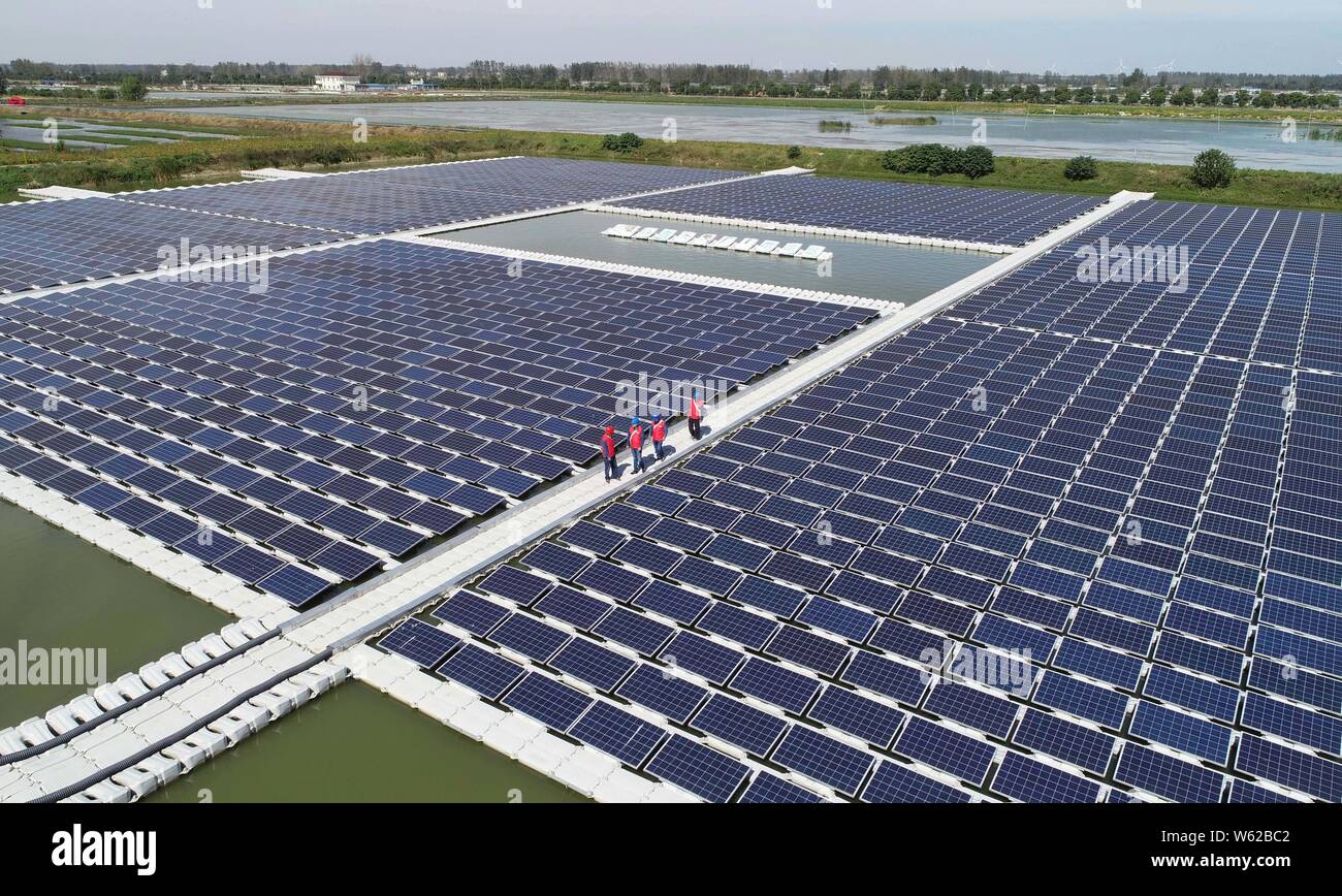 Aerial view of a floating solar energy farm at a photovoltaic power ...