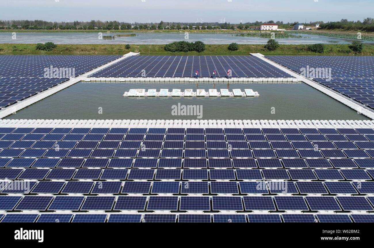 Aerial view of a floating solar energy farm at a photovoltaic power ...