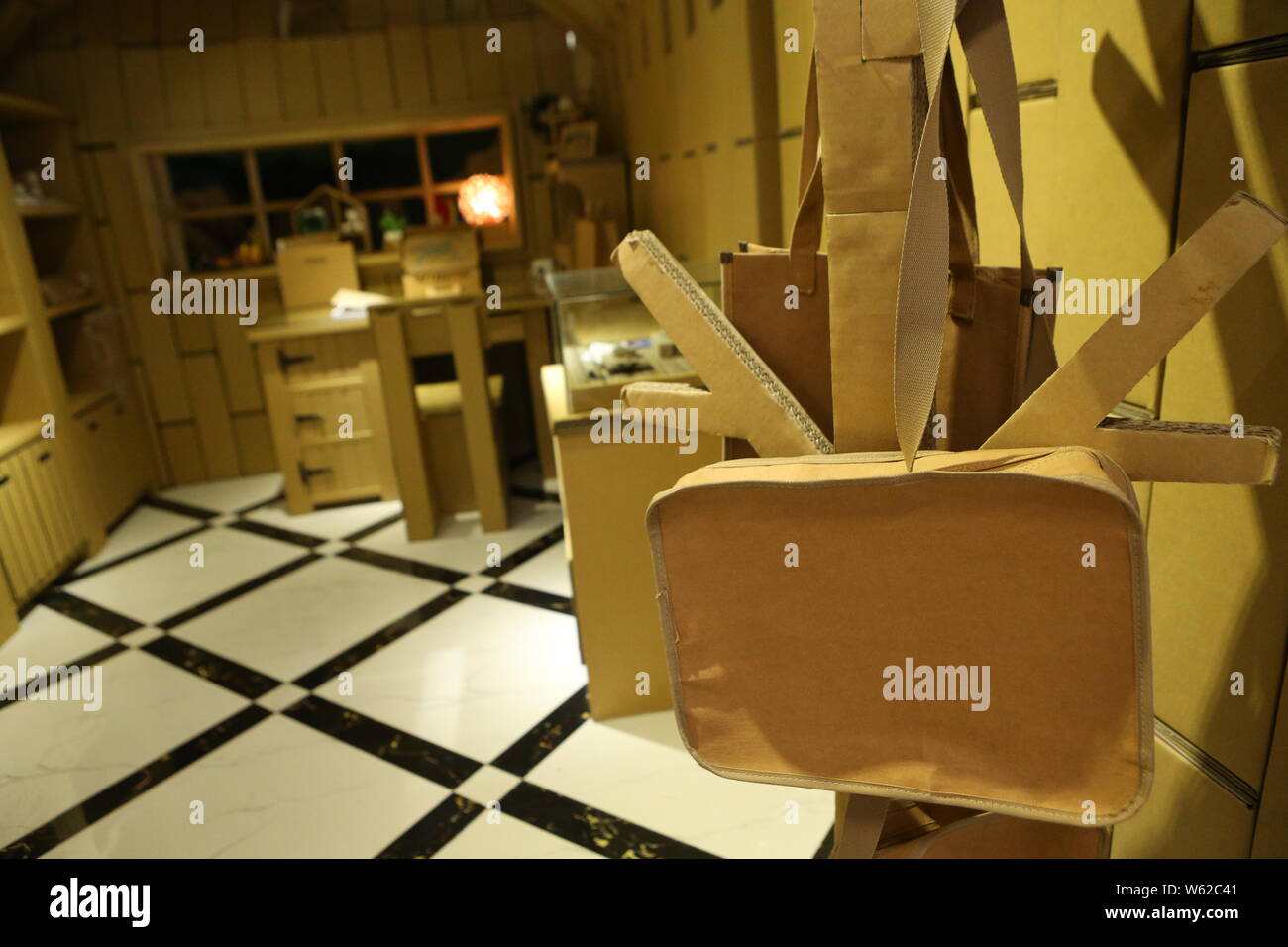 Different creative products made out of cartons are displayed in ...