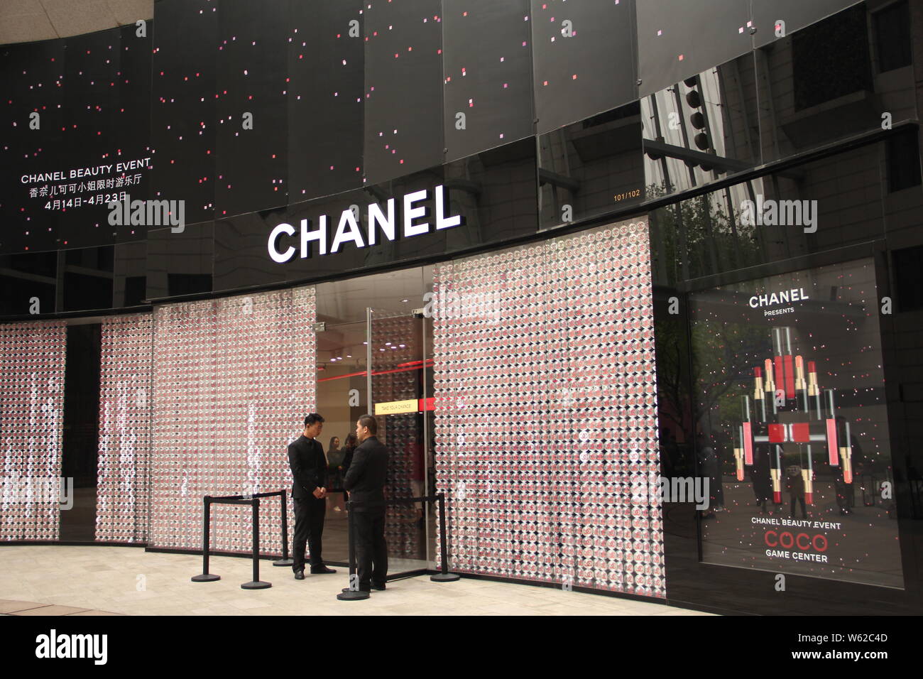 --FILE--Chinese employees are seen in front of a boutique of Chanel in ...