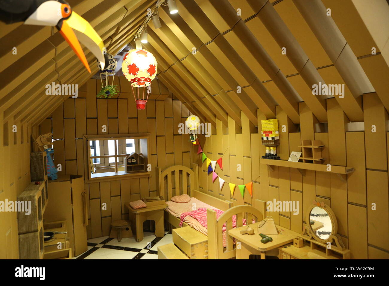 Different creative products made out of cartons are displayed in ...