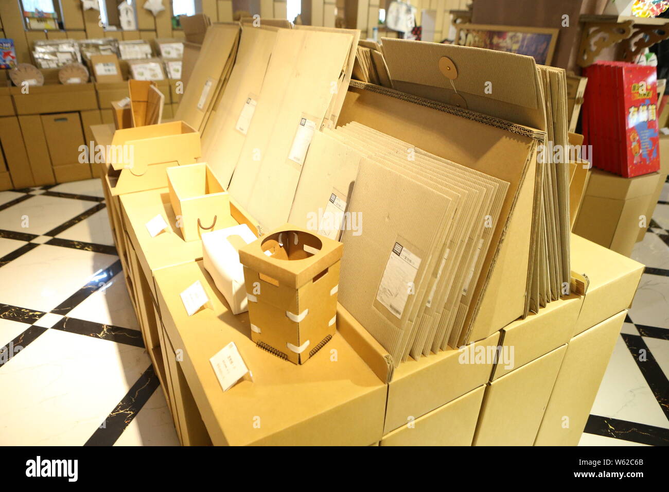 Different creative products made out of cartons are displayed in ...