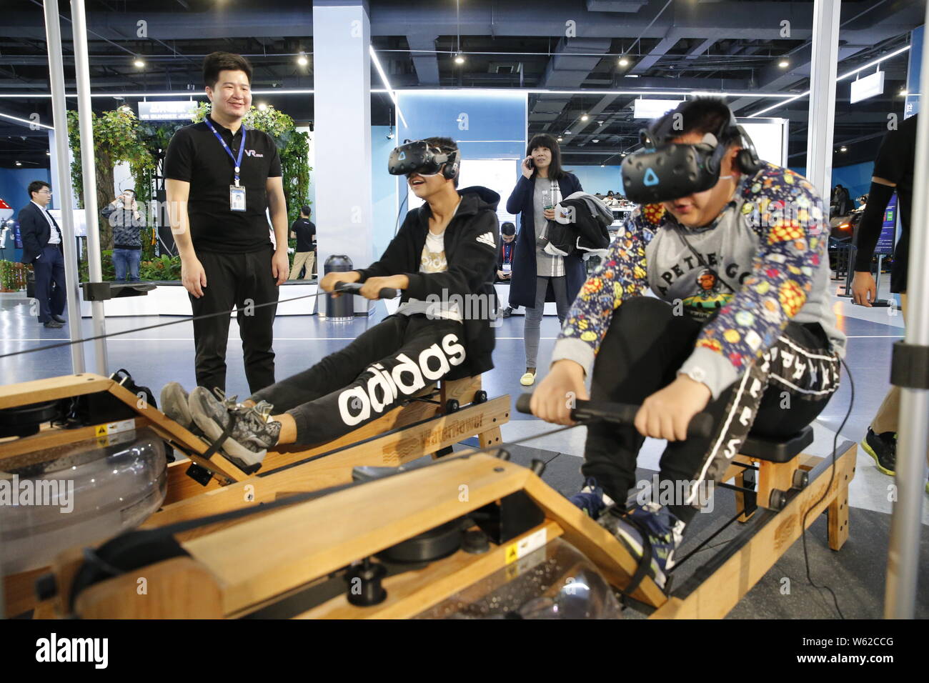 --FILE--Visitors try out VR (virtual reality) devices at the SoReal VR ...