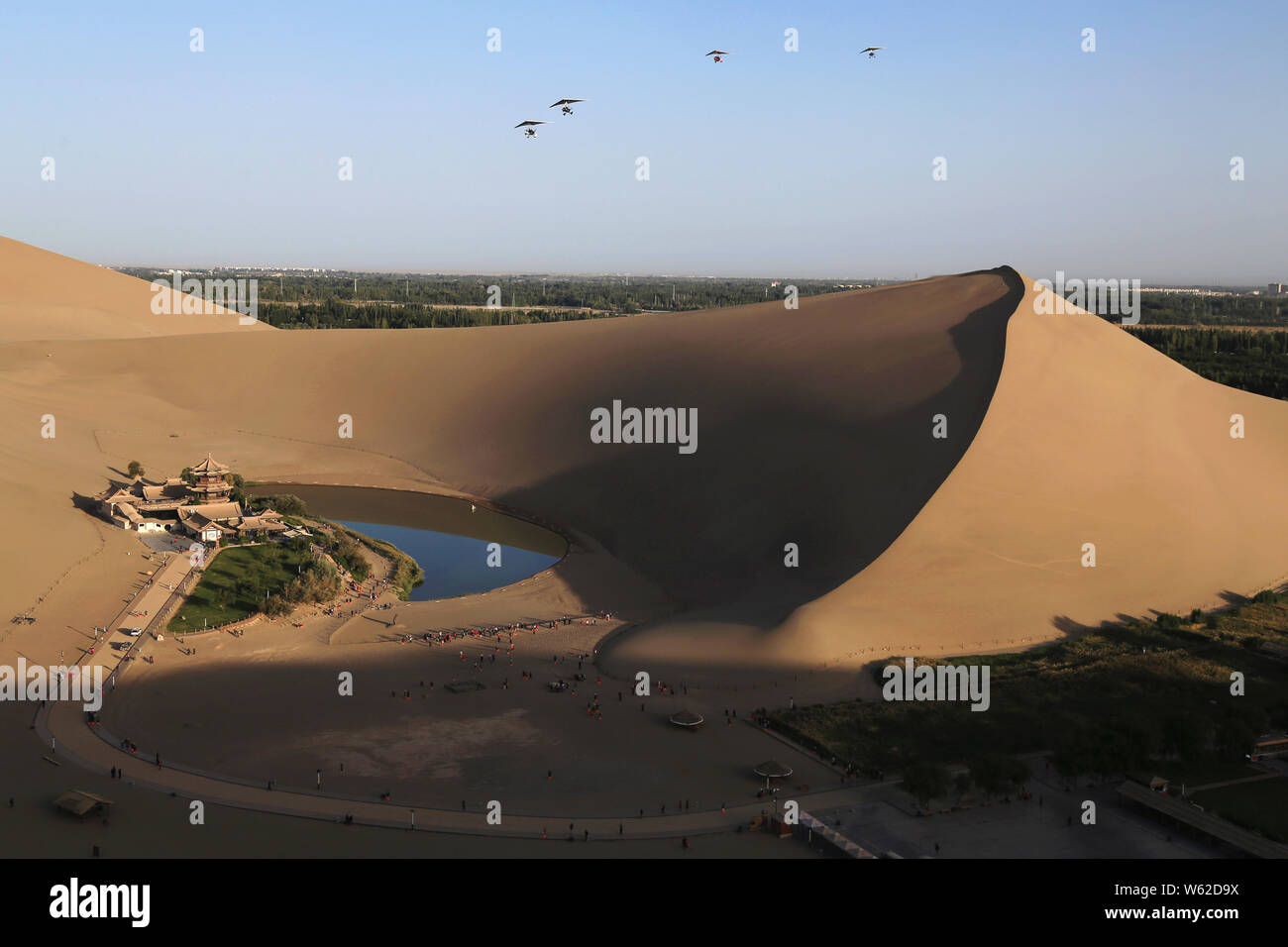 View of the Crescent Moon Lake, also known as Yueya Spring, surrounded ...