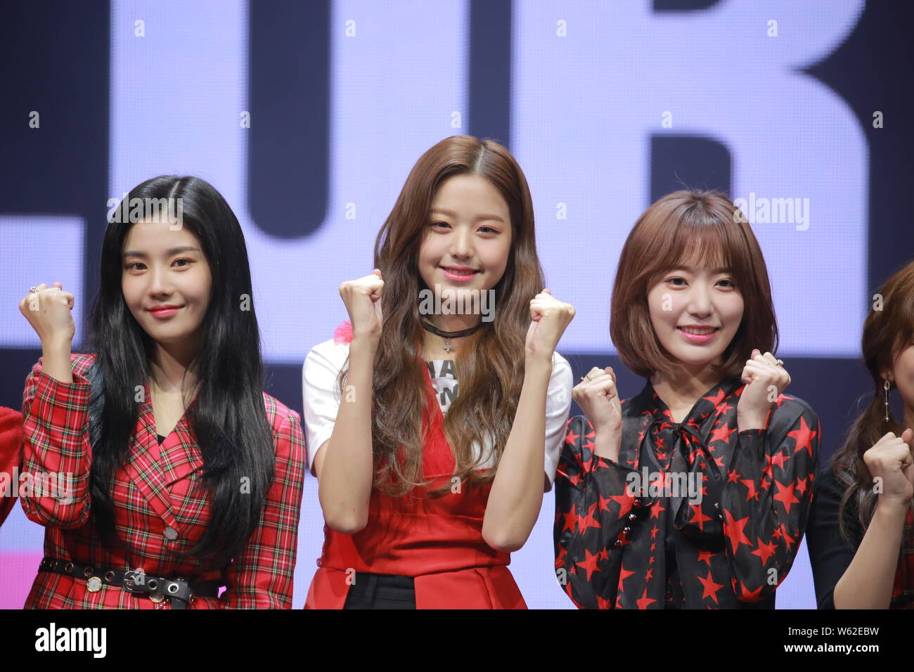 Members of South Korean girl group Izone, stylized as IZ*ONE, perform ...