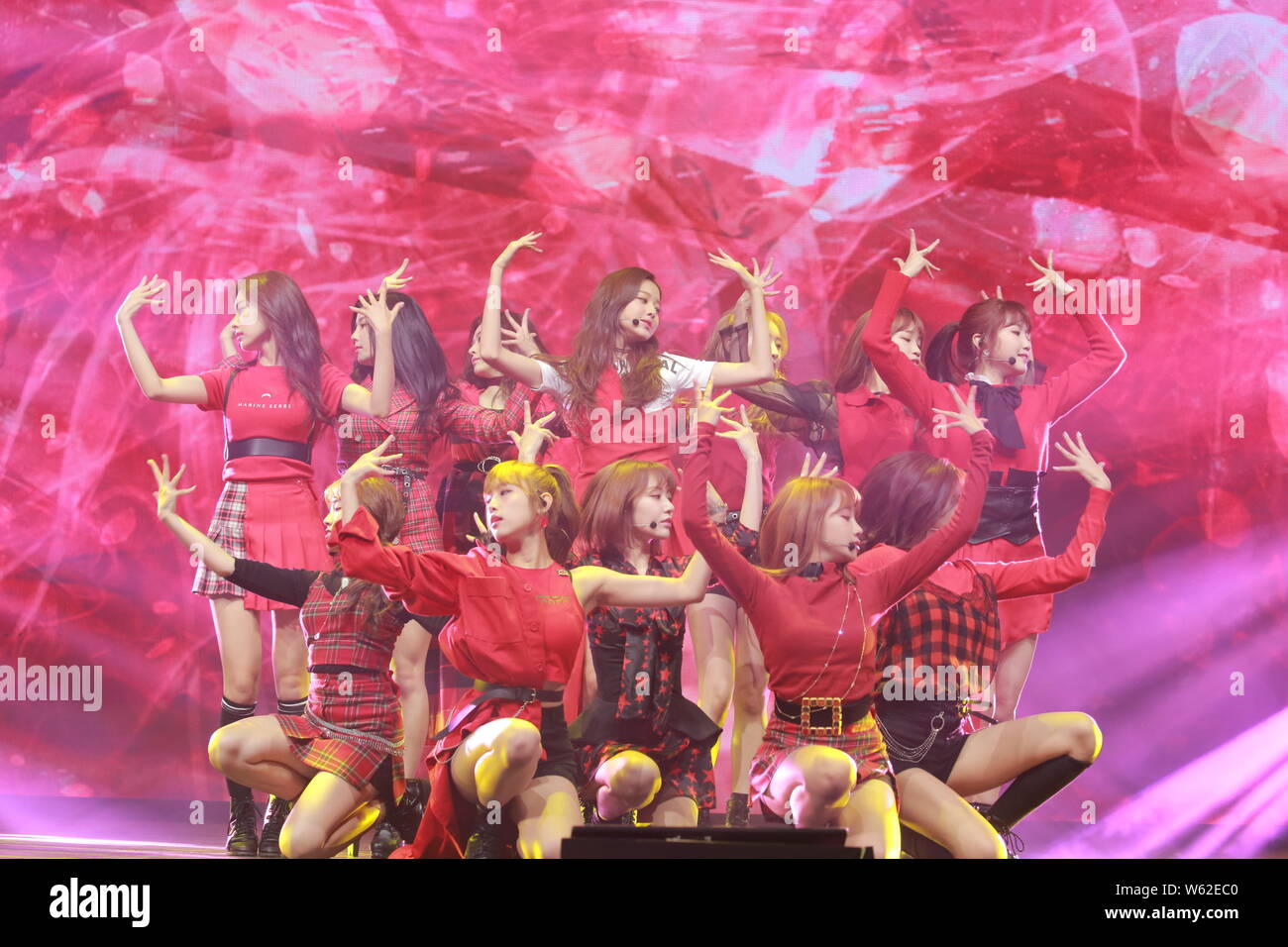 Members of South Korean girl group Izone, stylized as IZ*ONE, perform ...