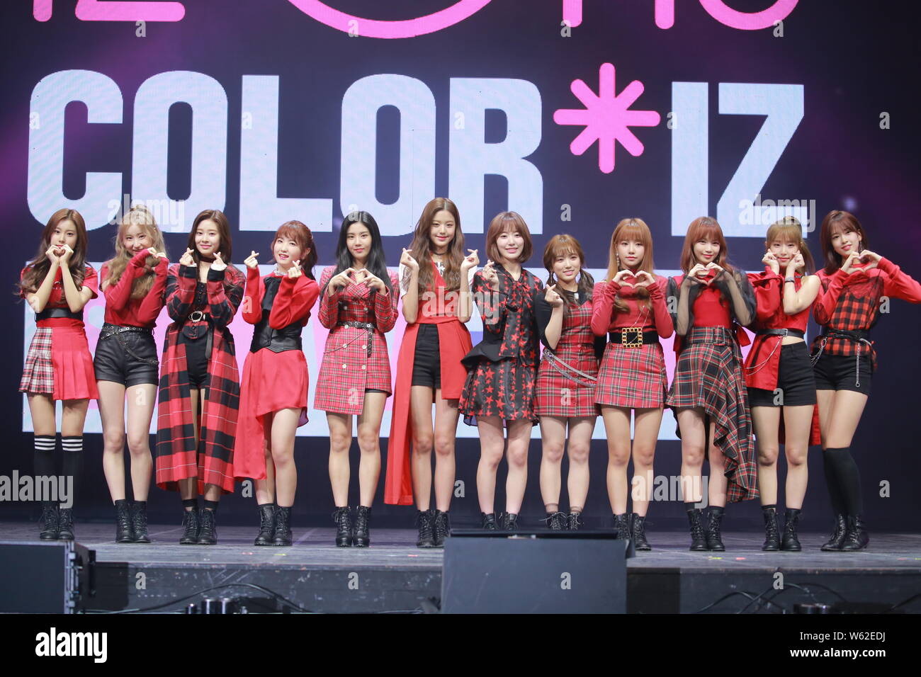 Members of South Korean girl group Izone, stylized as IZ*ONE, perform ...