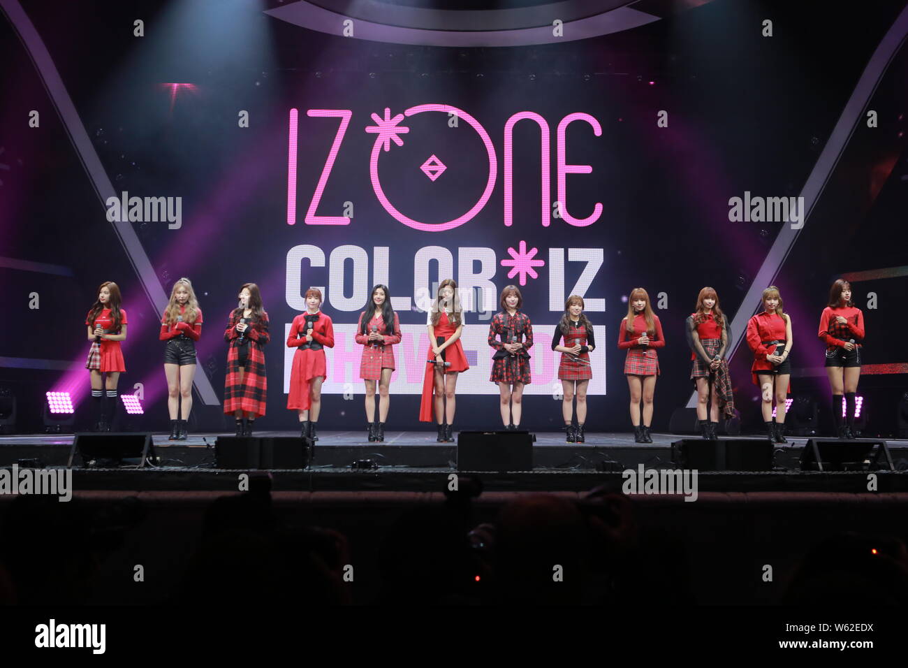 Members of South Korean girl group Izone, stylized as IZ*ONE, perform ...