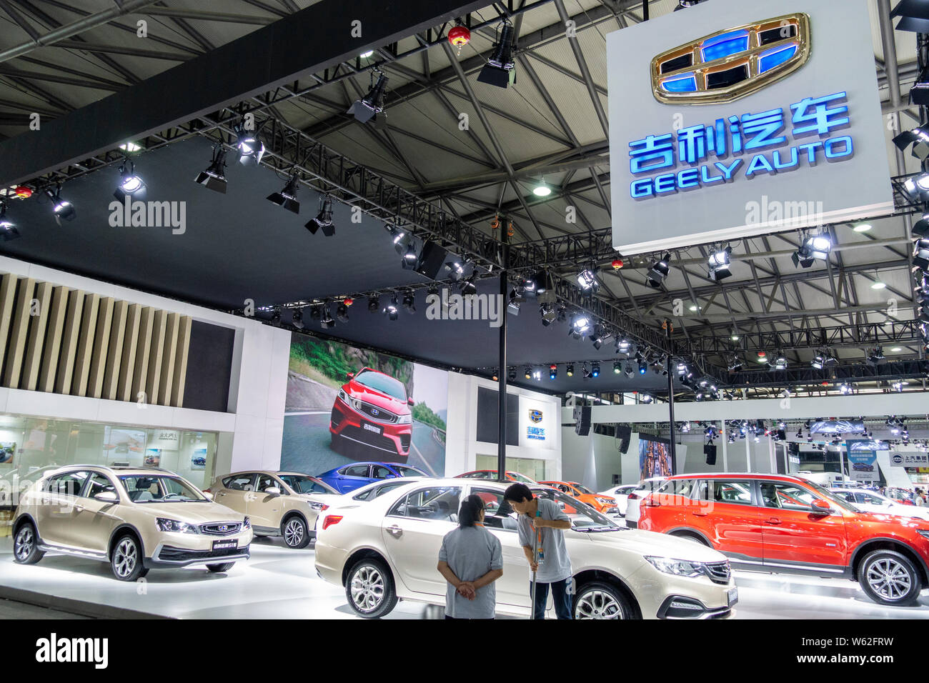 --FILE--People visit the stand of Geely Auto during the Shanghai Pudong ...