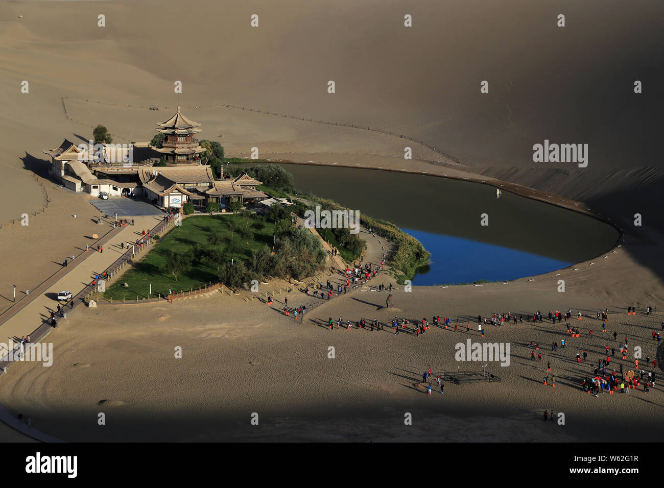 View of the Crescent Moon Lake, also known as Yueya Spring, surrounded ...