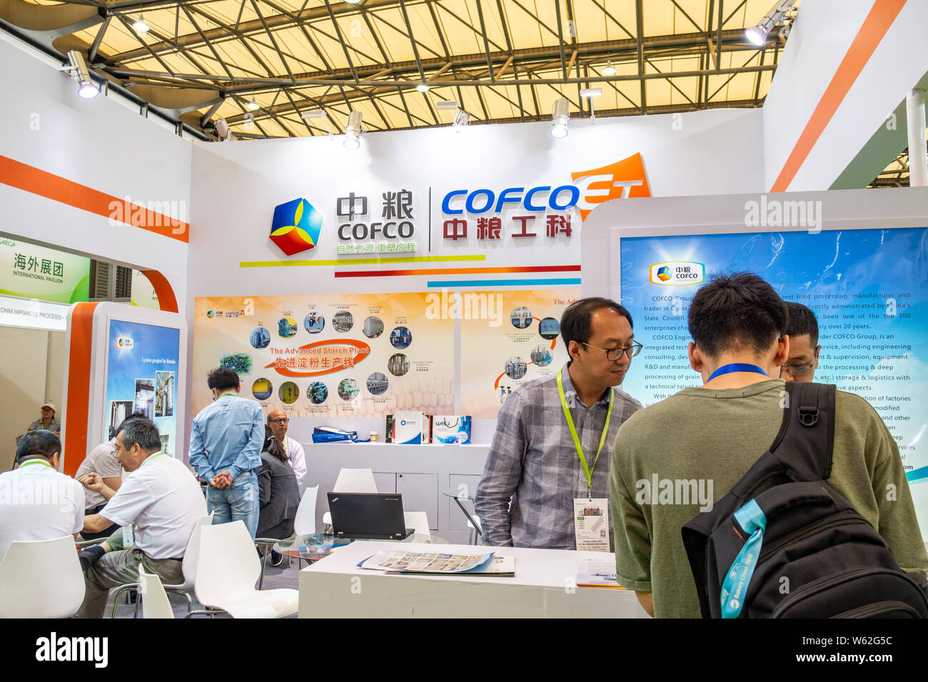--FILE--People visit the stand of COFCO (China National Cereals, Oils ...