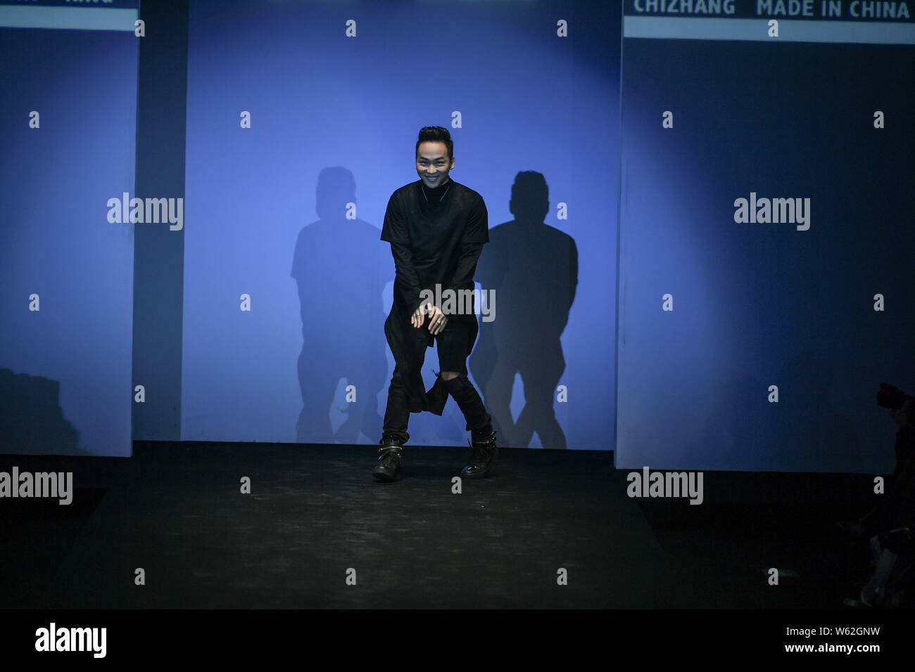 Chinese designer Zhang Chi poses at the fashion show of AudiQ2L Á CHI ...