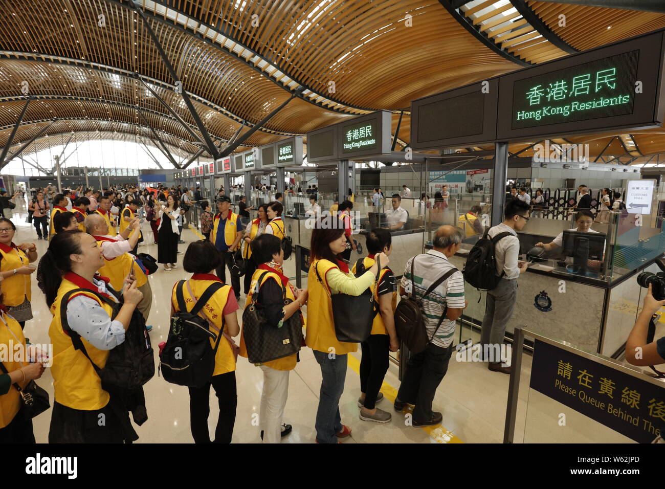 Passengers queue up to take a coach from Kwoon Chung Bus over the world ...