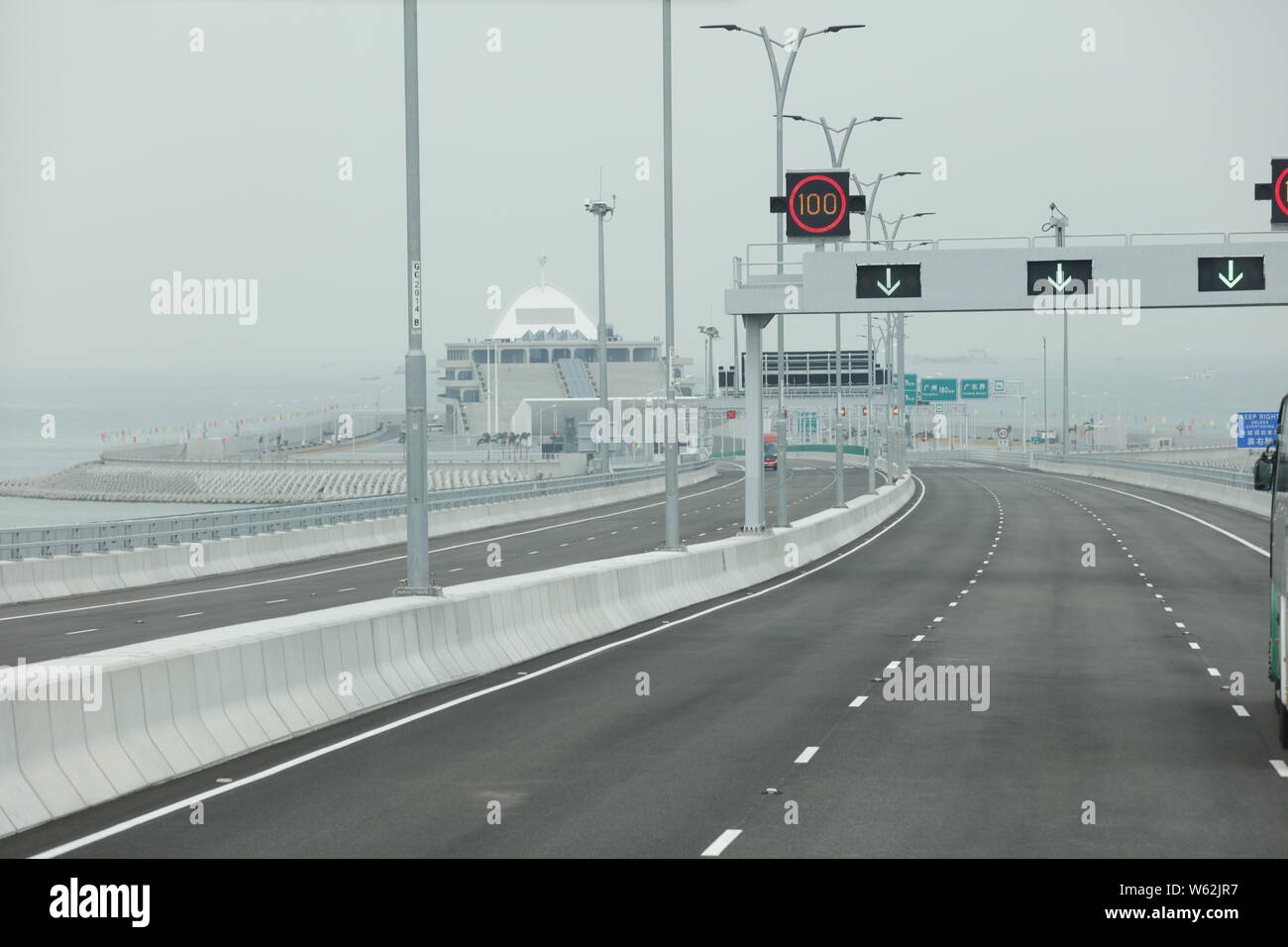 Vehicles travel on the world's longest cross-sea bridge, the Hong Kong ...