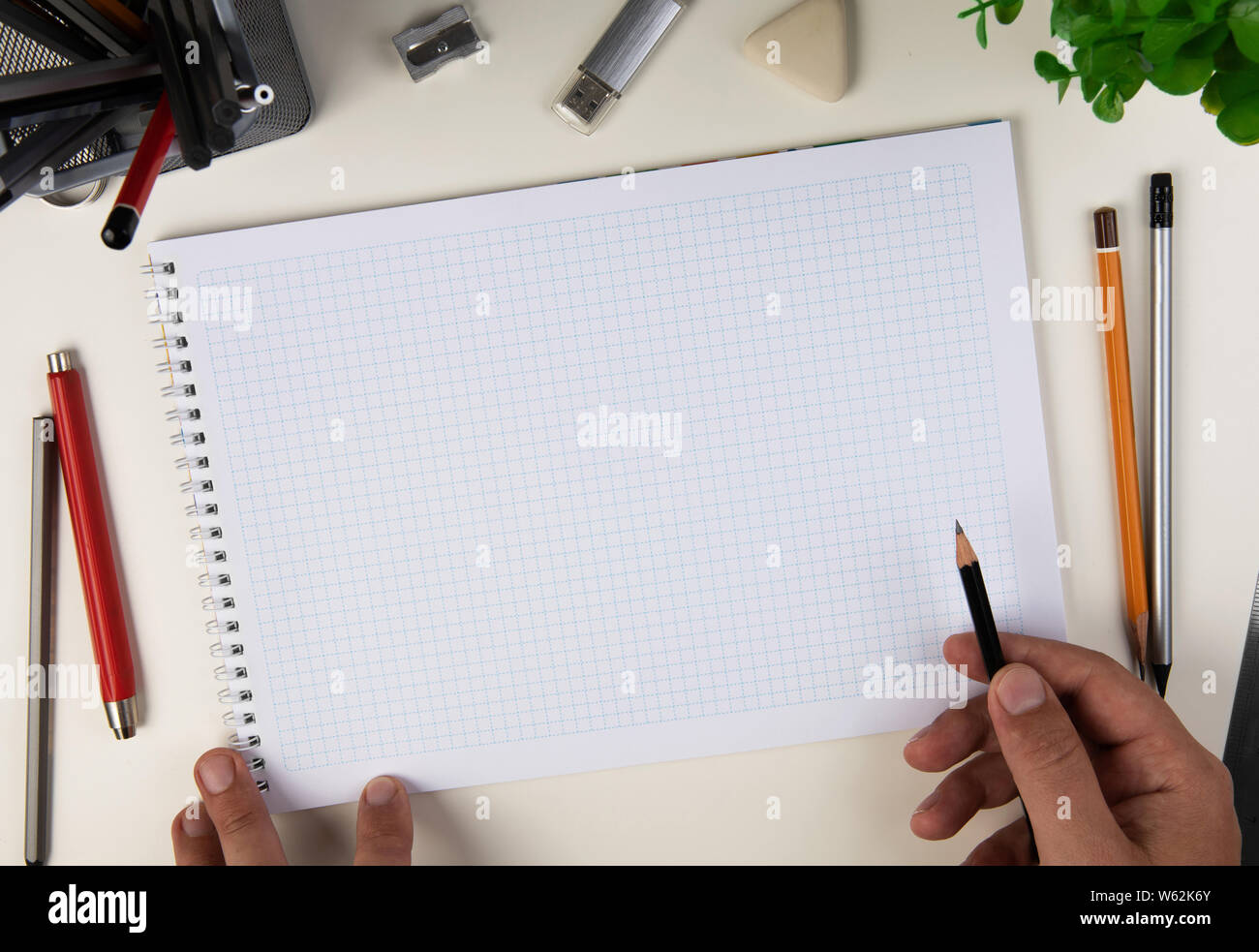 Human hand with pencil prepare to writing on notebook Stock Photo - Alamy