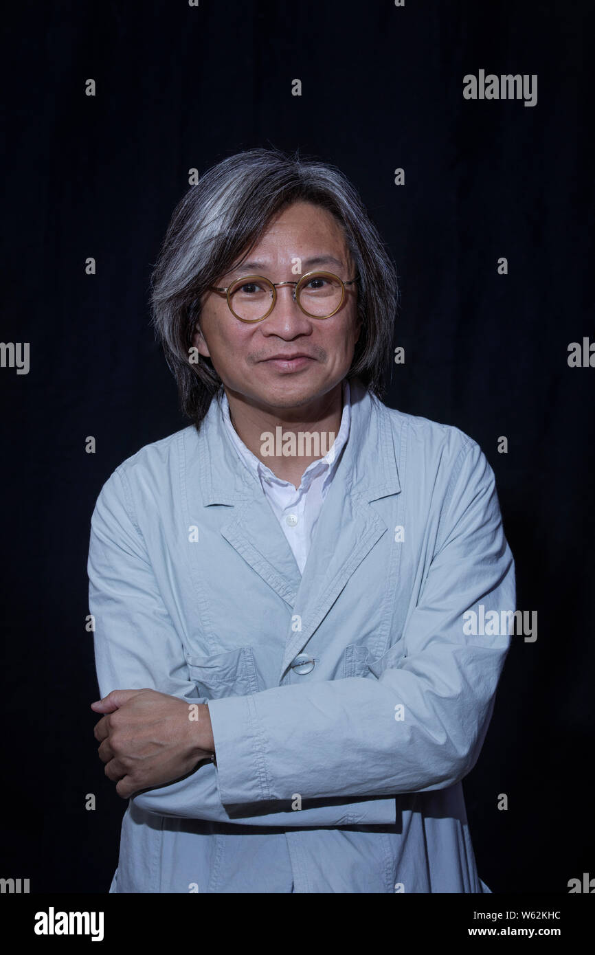 Hong Kong director Peter Chan poses for portrait photos during an exclusive interview by ...