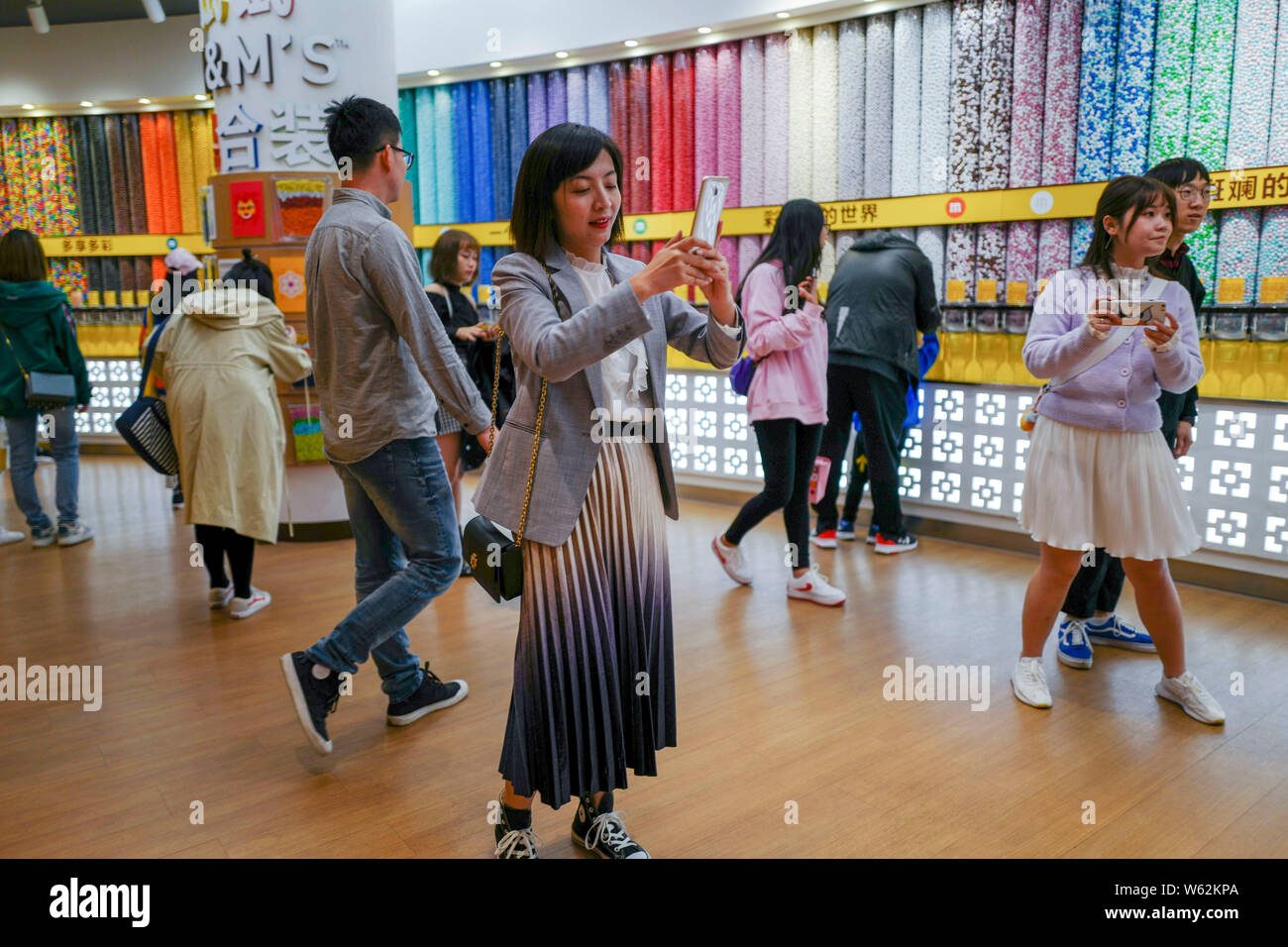 Customers visit the M&M's World flagship store in Shanghai, China, 19 ...