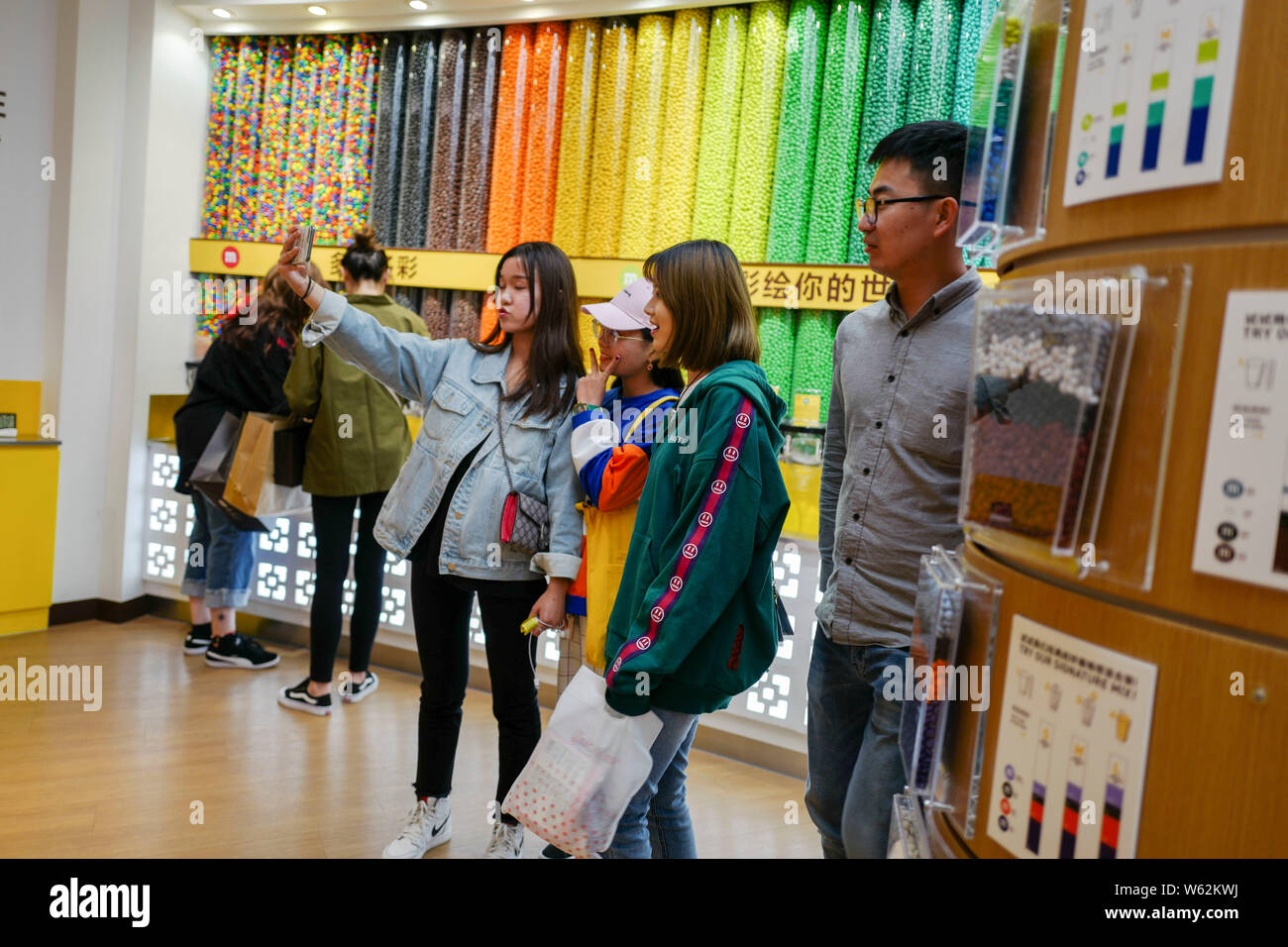 Customers visit the M&M's World flagship store in Shanghai, China, 19 ...