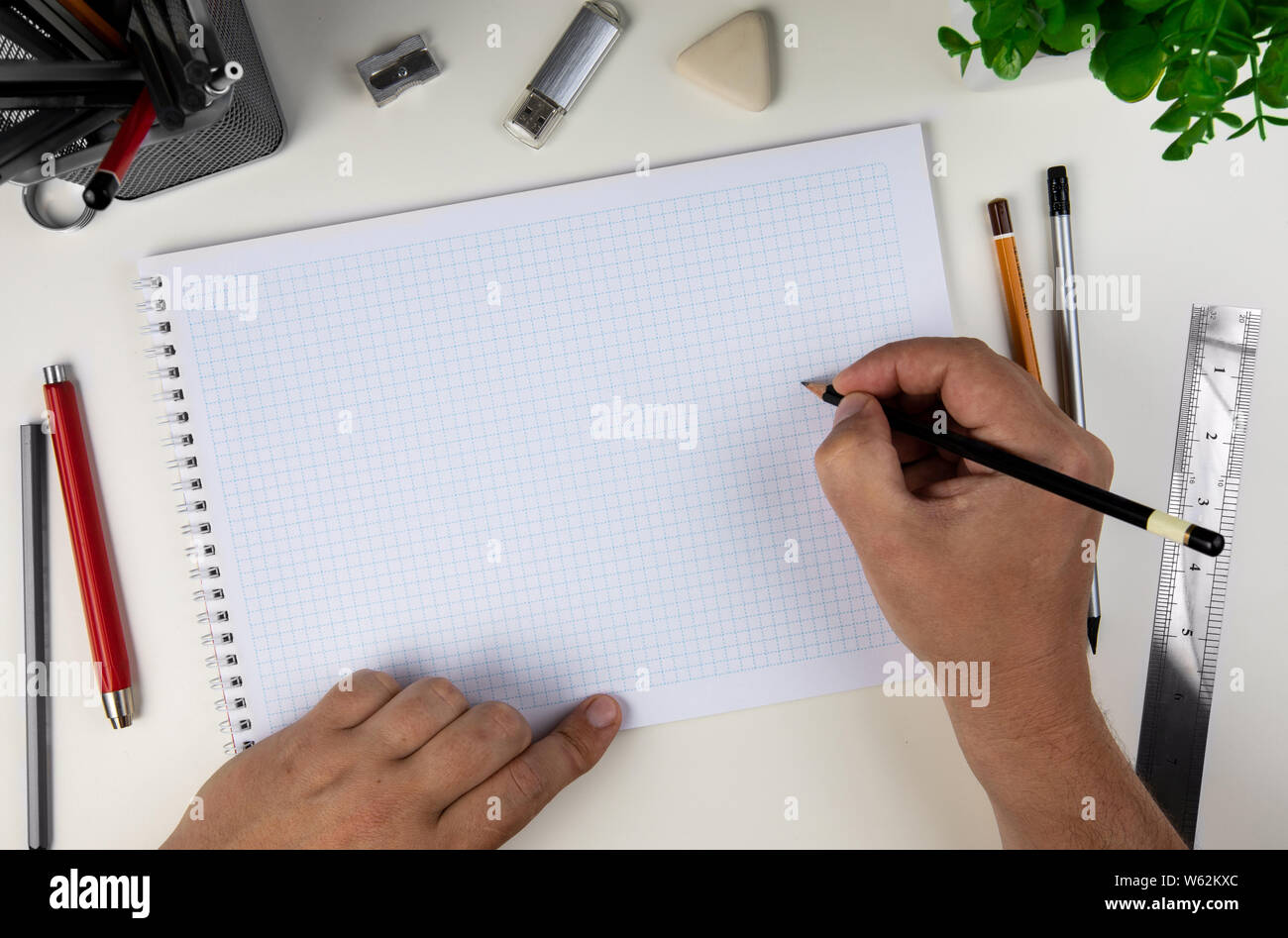 Human hand with pencil prepare to writing on notebook Stock Photo - Alamy
