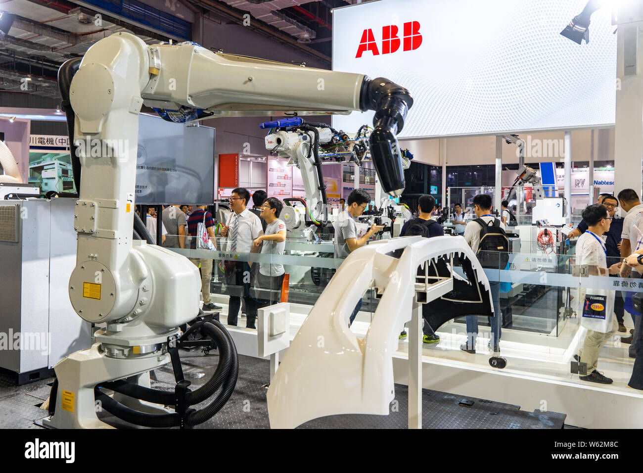 --FILE--A robot arm is on display at the stand of ABB during the 20th ...