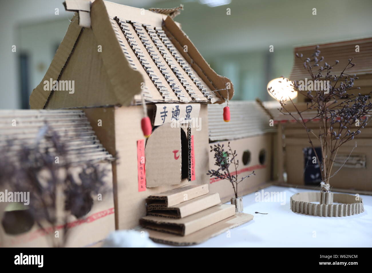 A scale model of an ancient city made of recycled package boxes by ...