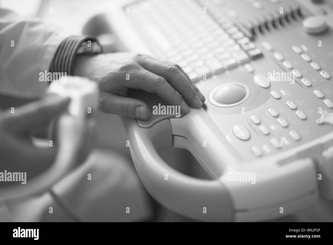 The doctor conducts ultrasonographic examination of the patient Stock ...