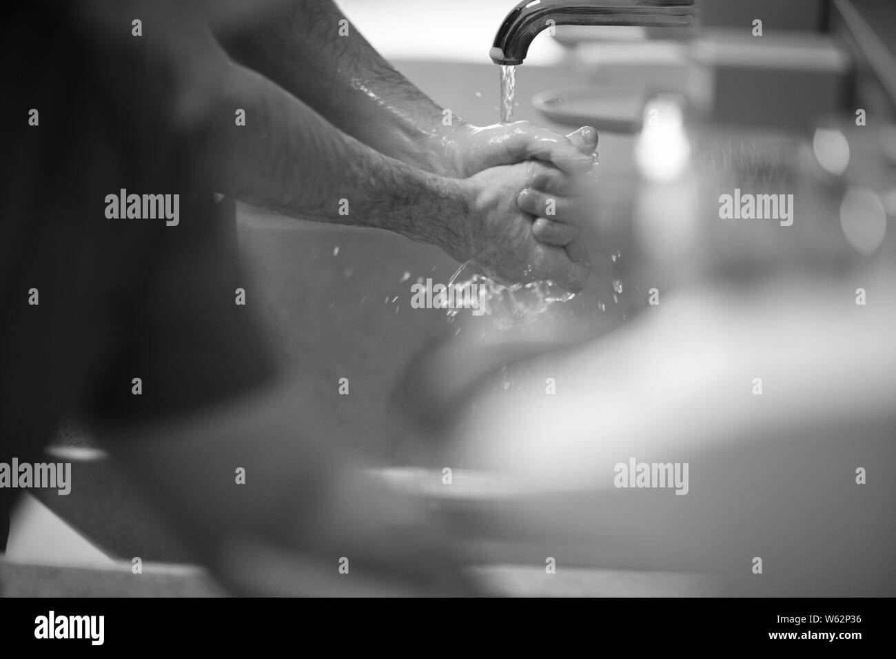 Doctor and assistant carefully wash their hands before surgery Stock ...