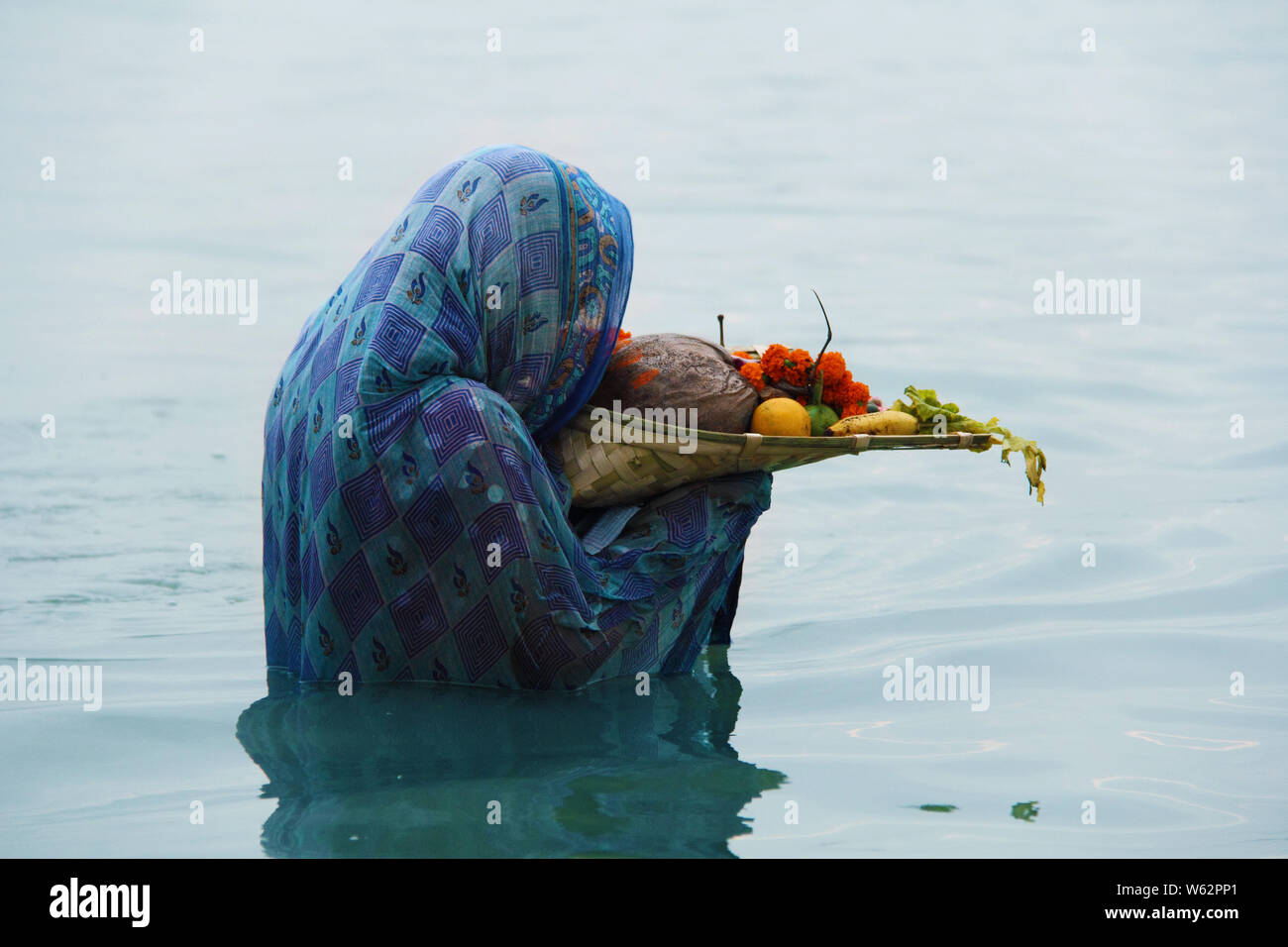 Woman Praying By The Water
