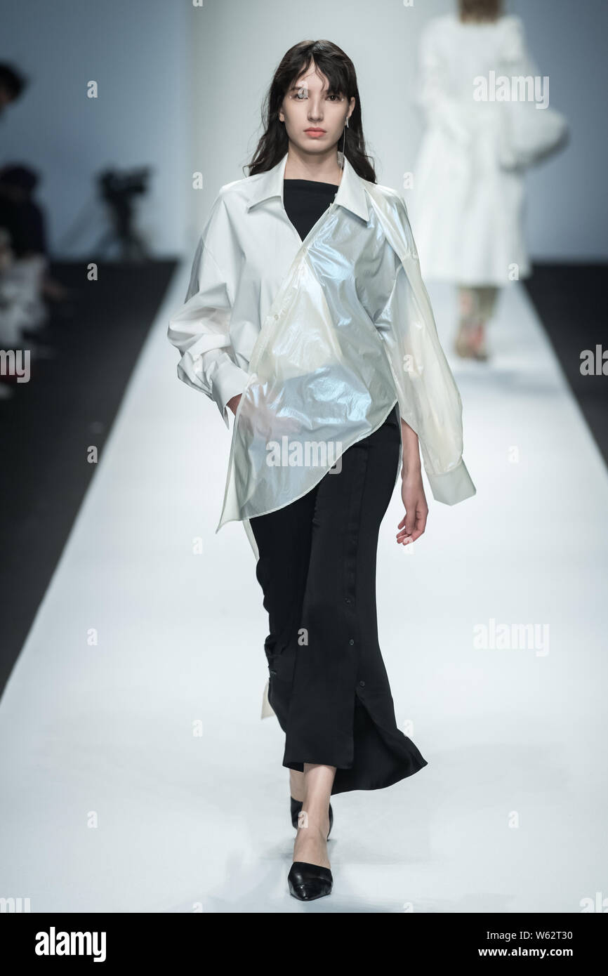 A model displays a new creation at the fashion show of Roderic Wong during the Shanghai Fashion ...
