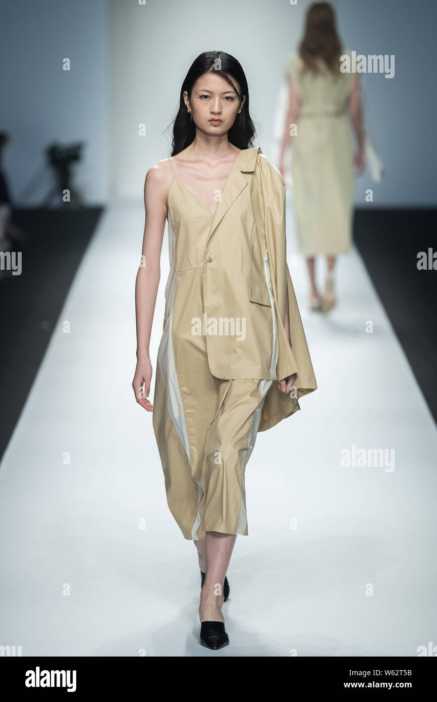 A model displays a new creation at the fashion show of Roderic Wong during the Shanghai Fashion ...